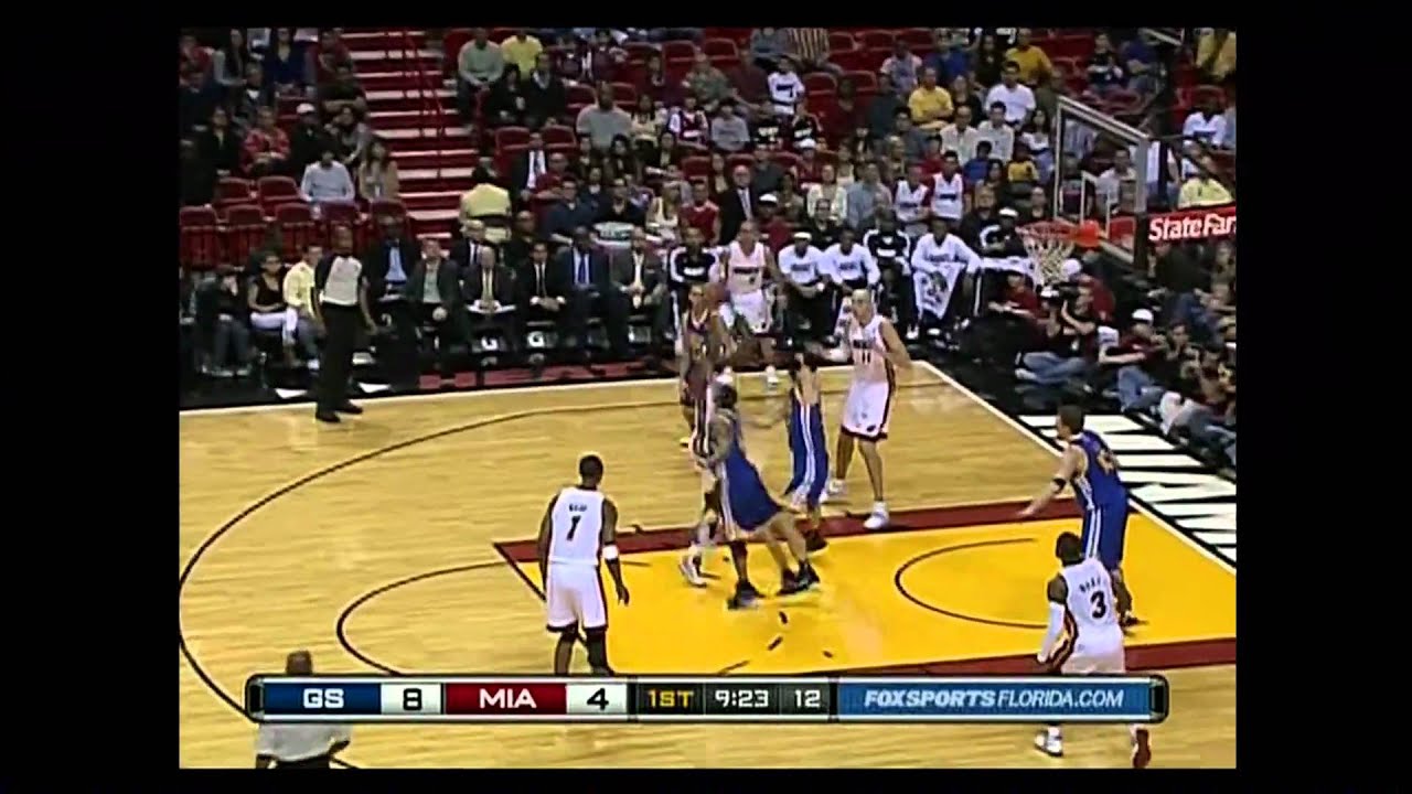 LeBron James fakes the pass behind his back and feeds it to Ilgauskas ...