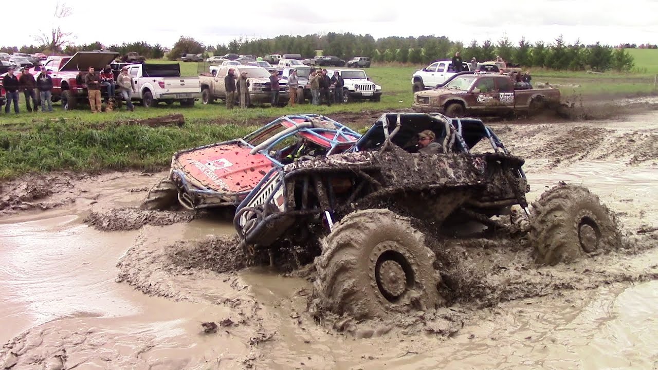 2 Swamp Buggies Squeeze Through At Waltons Mud Bog - YouTube