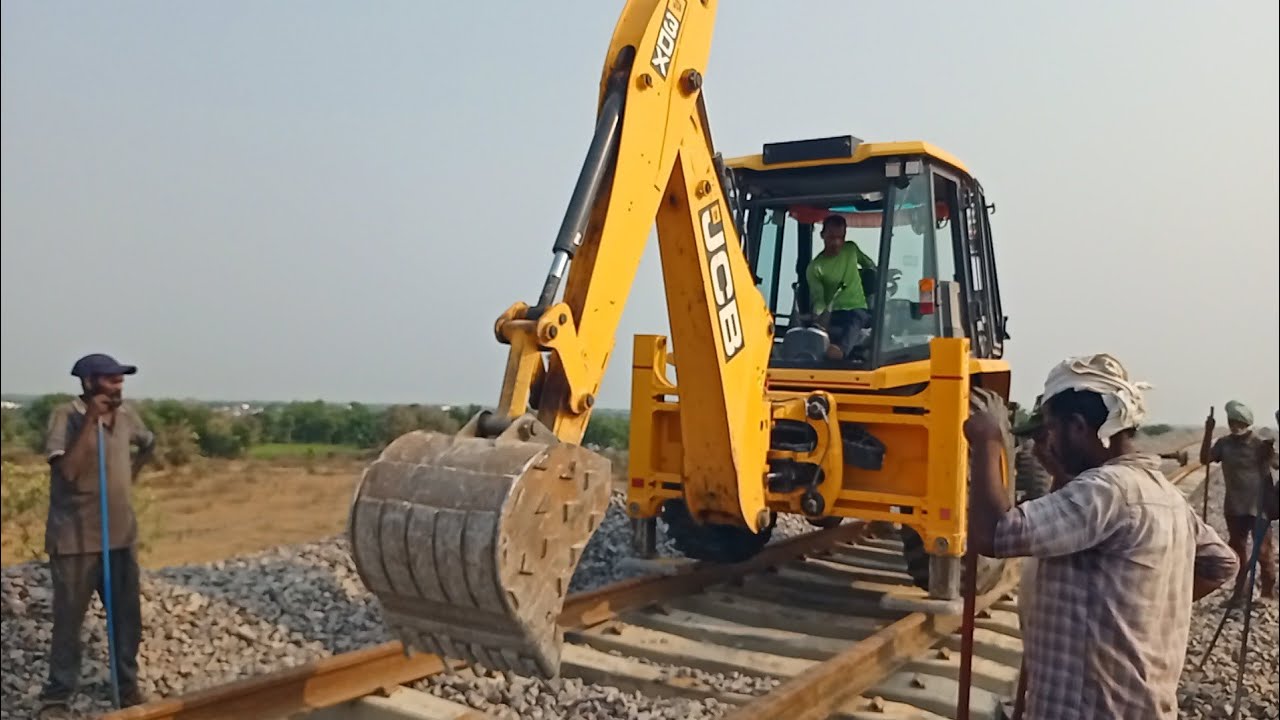 Railway track installation With jcb - YouTube