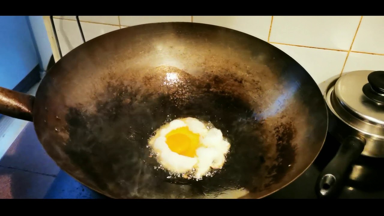 Using, cleaning and caring for your carbon steel wok - YouTube