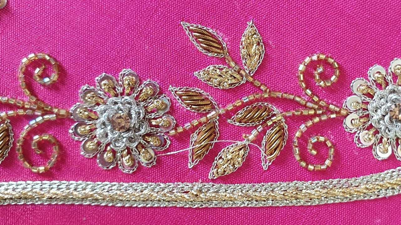 very grand floral aari work hand work blouse design using normal needle ...