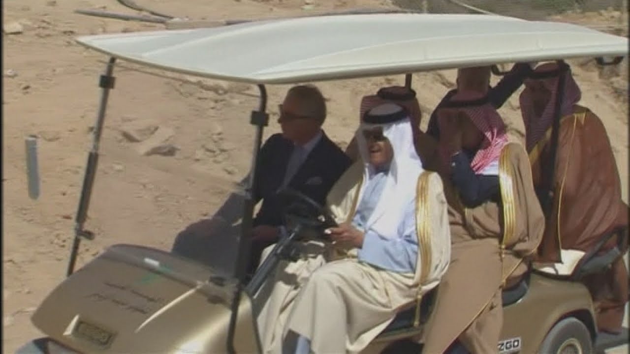 Prince Charles rides golden golf cart round Saudi historic town - YouTube