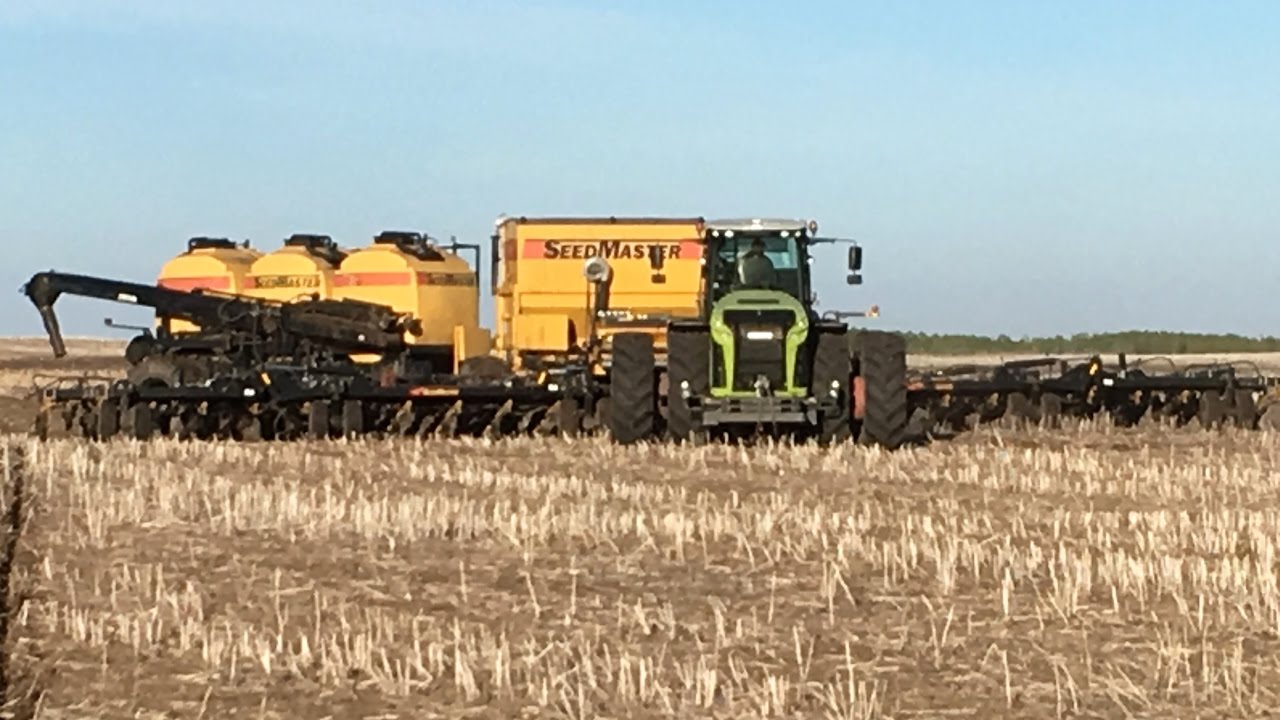 Claas Xerion 5000 pulling big Seedmaster drill - YouTube