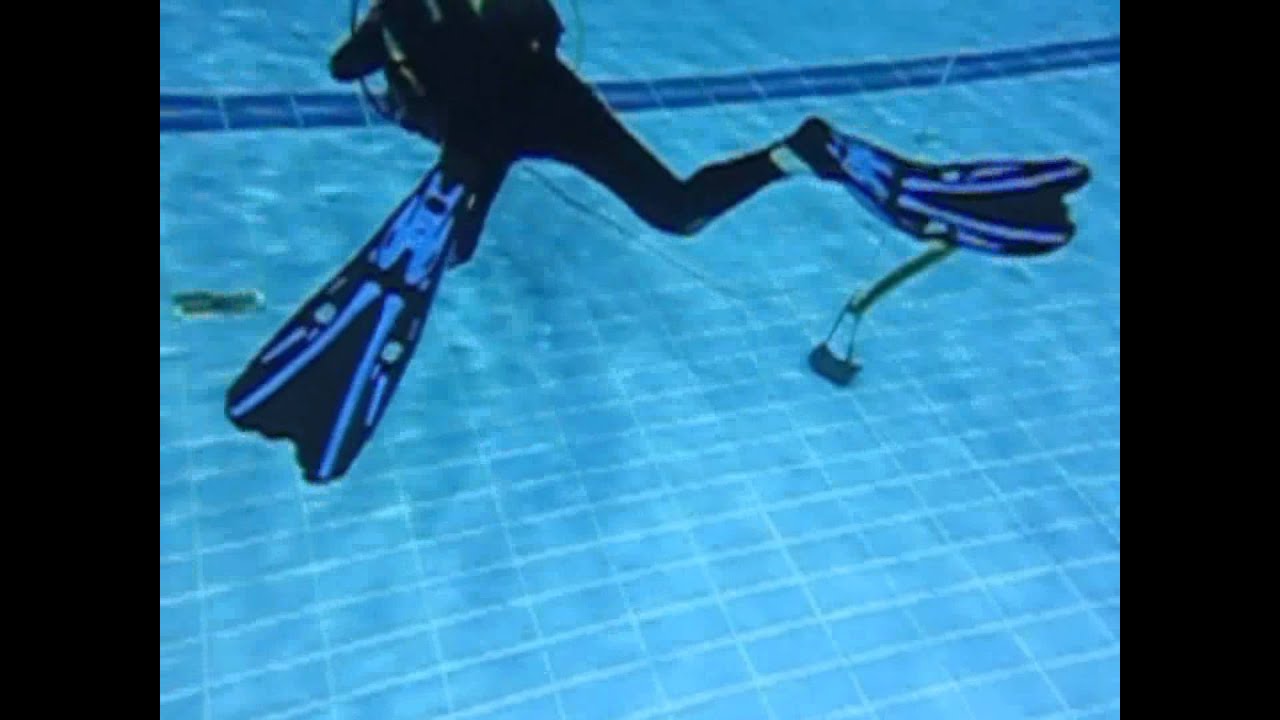 Entry level scuba trainees practice basic scuba skills in the pool ...