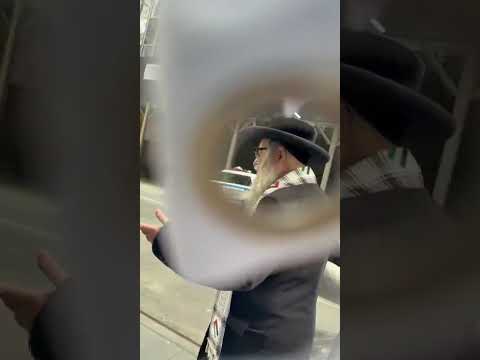 orthodox jew debates NETUREI  KARTA AT ISRAEL PARADE NYC 2026