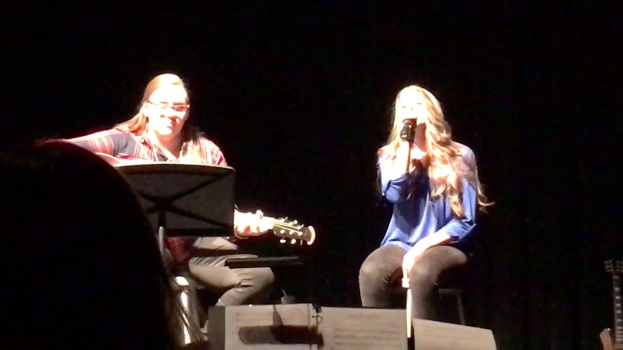 Abigail Fuqua singing “Temporary Home” accompanied by guitarist friend ...