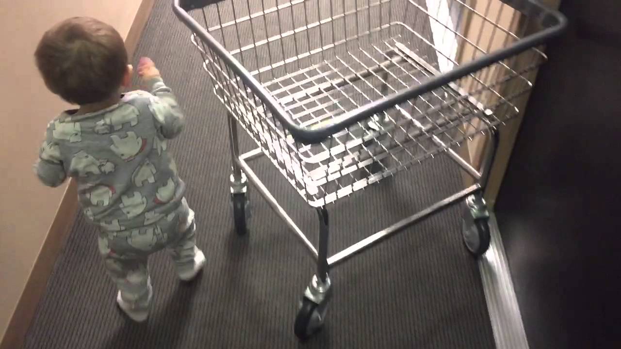 Logan pushing laundry cart - YouTube