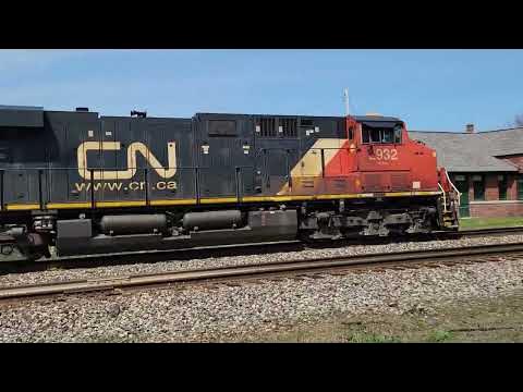 CN 2932, 2905 pull an Eastbound freight train with a PHMX depressed center flat car at Vicksburg ...