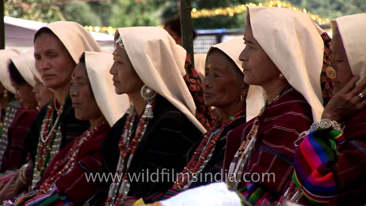 Rung women wearing traditional clothing and a large golden nose pin ...