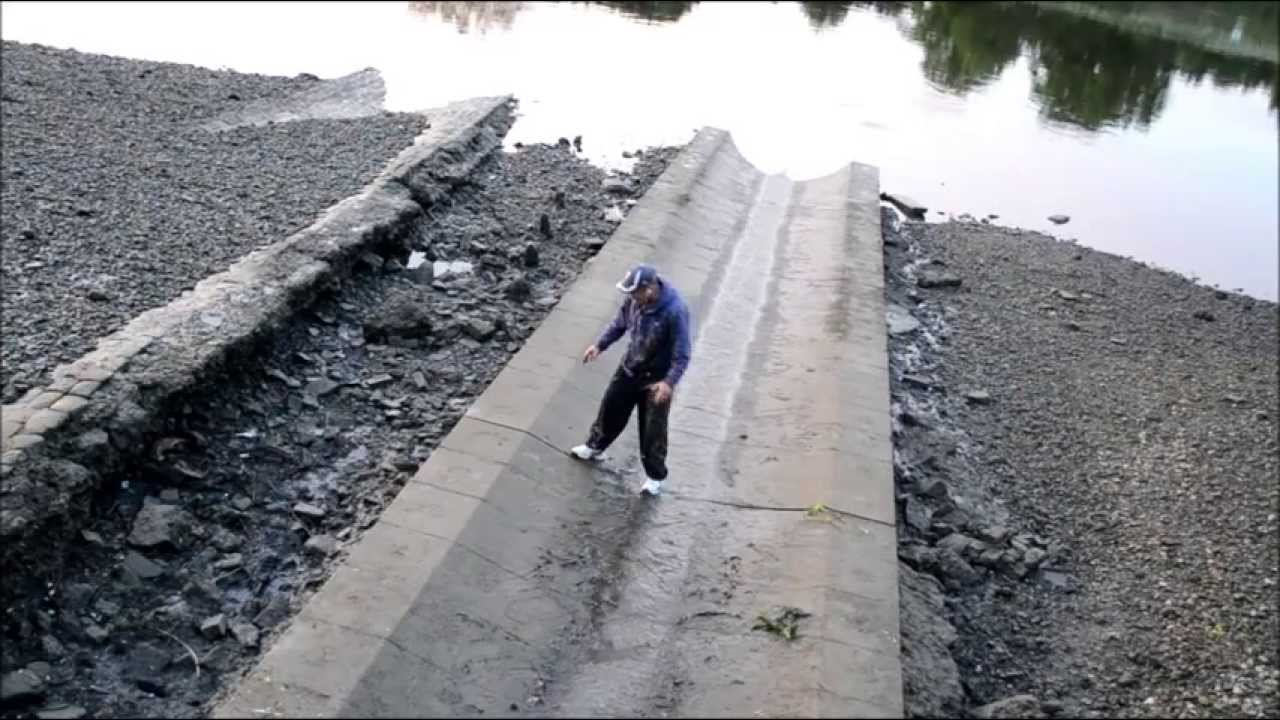 Fail.man slips on mud down the river!! face plant - YouTube