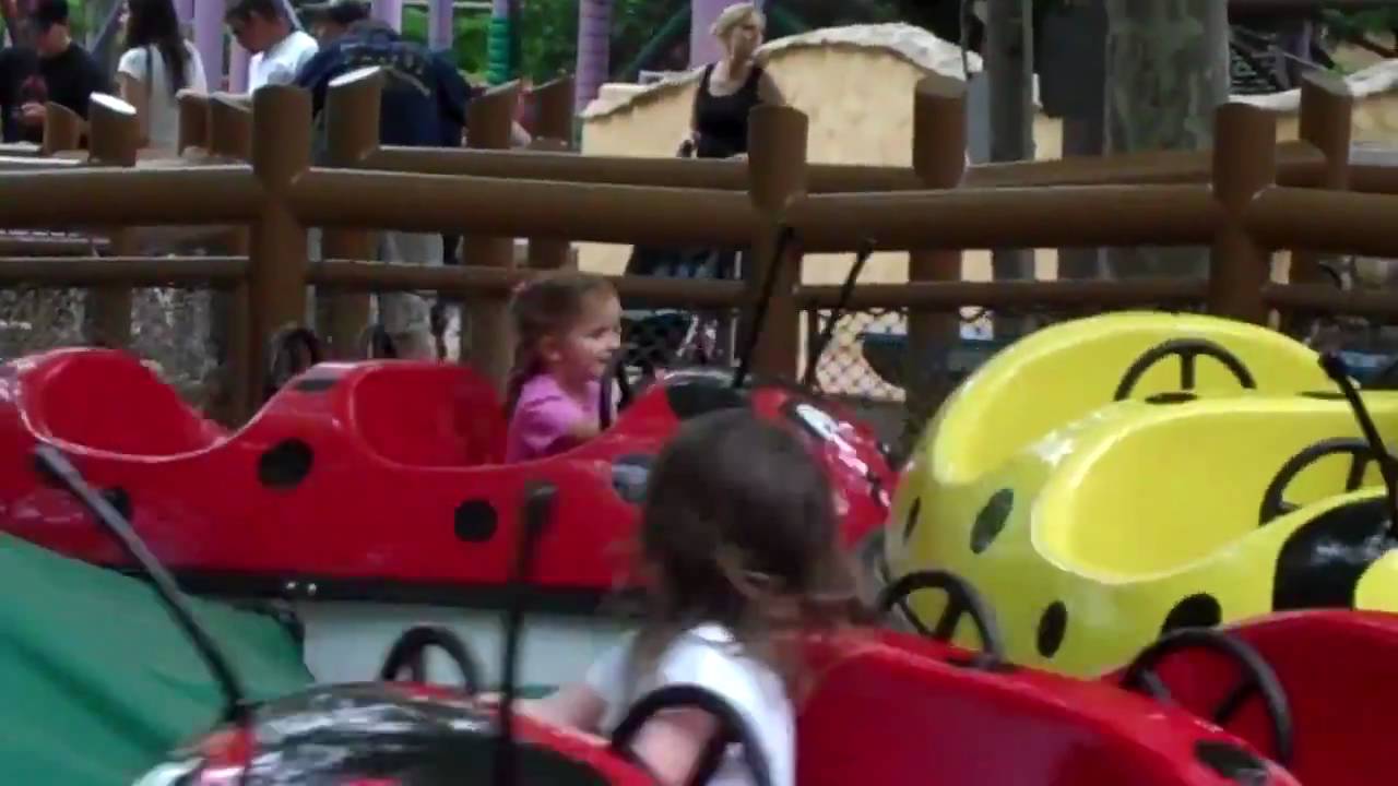 Riding the lady bug cars - YouTube