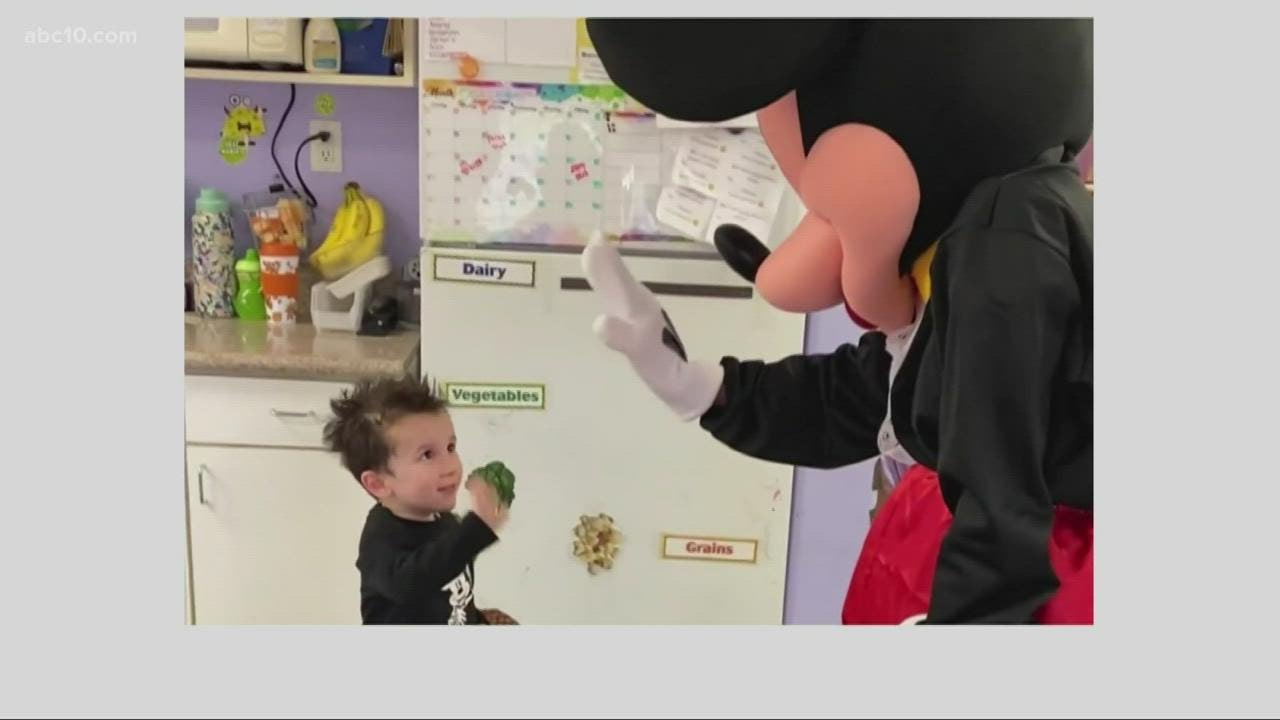 Boy with autism surprised by Mickey Mouse character who didn't make a ...