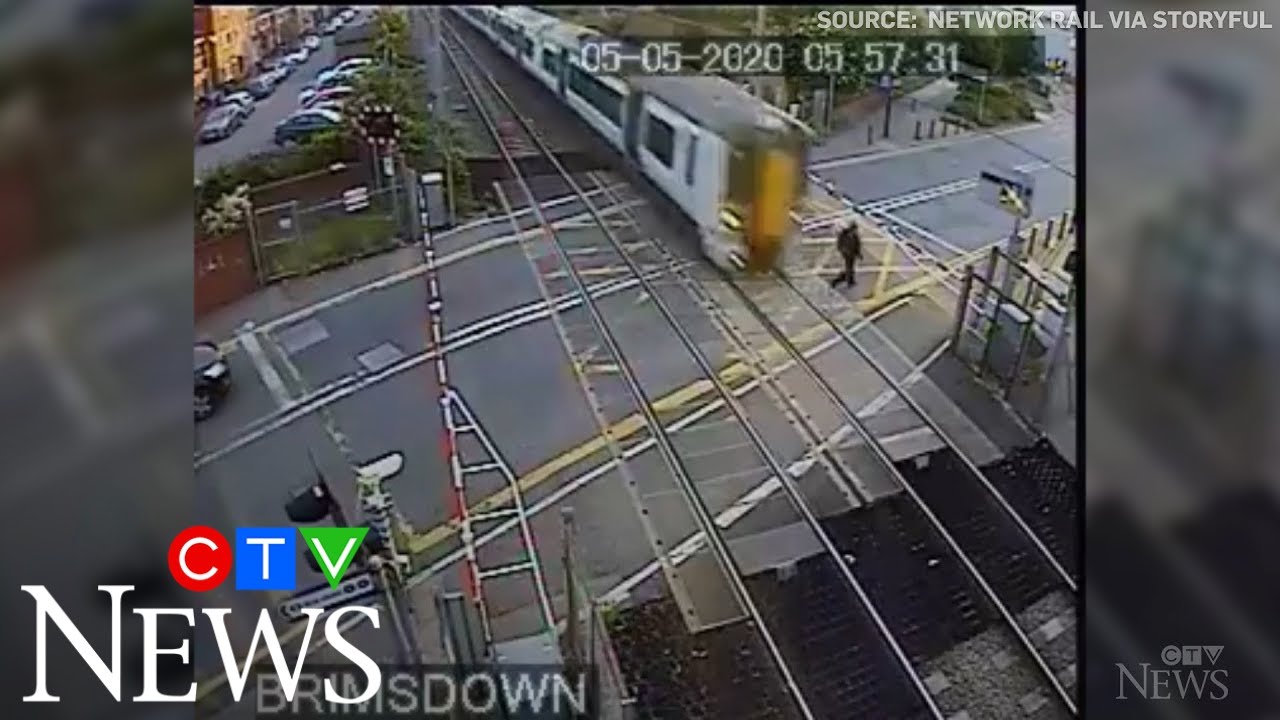 Caught on cam: Reckless pedestrian nearly hit by train - YouTube