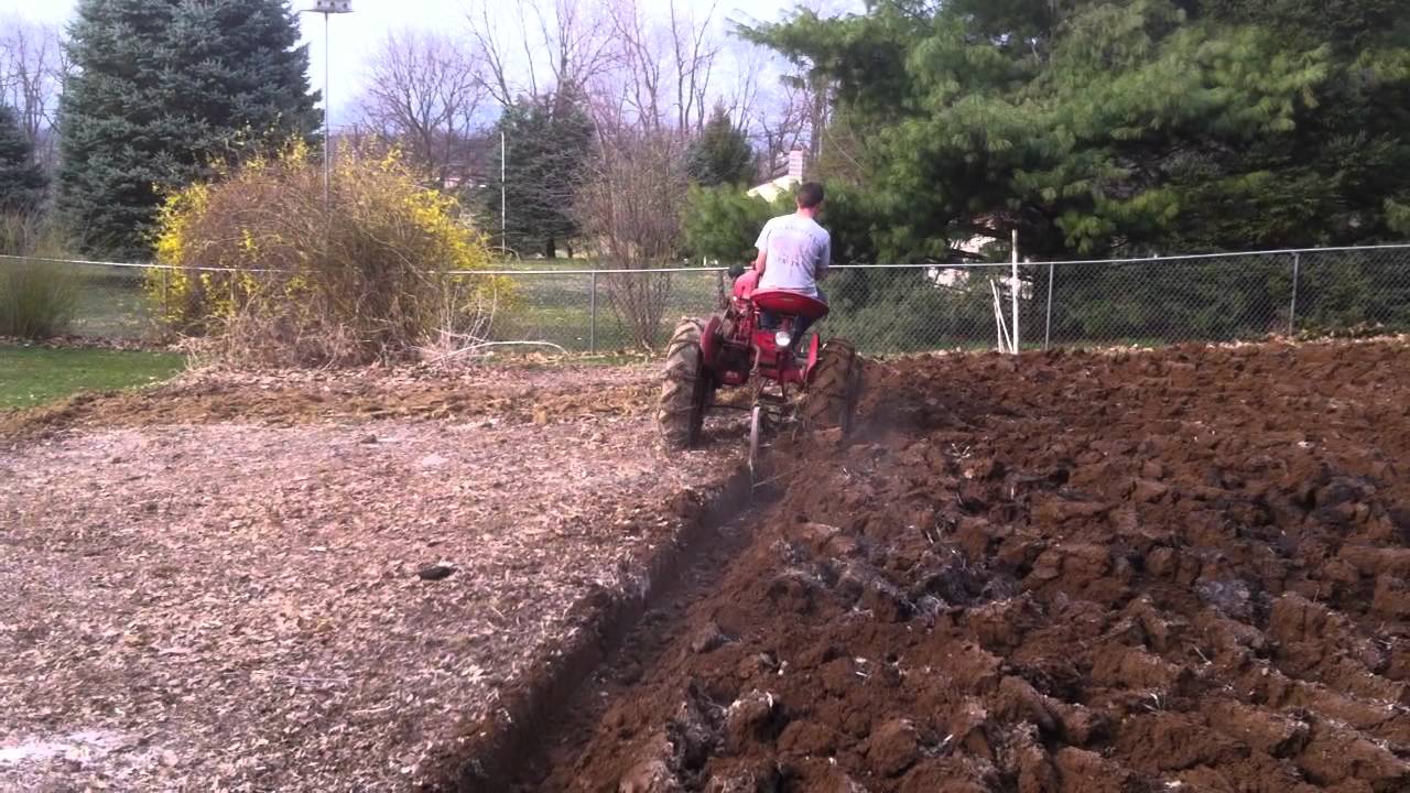 Farmall Cub Plowing up the Garden - YouTube