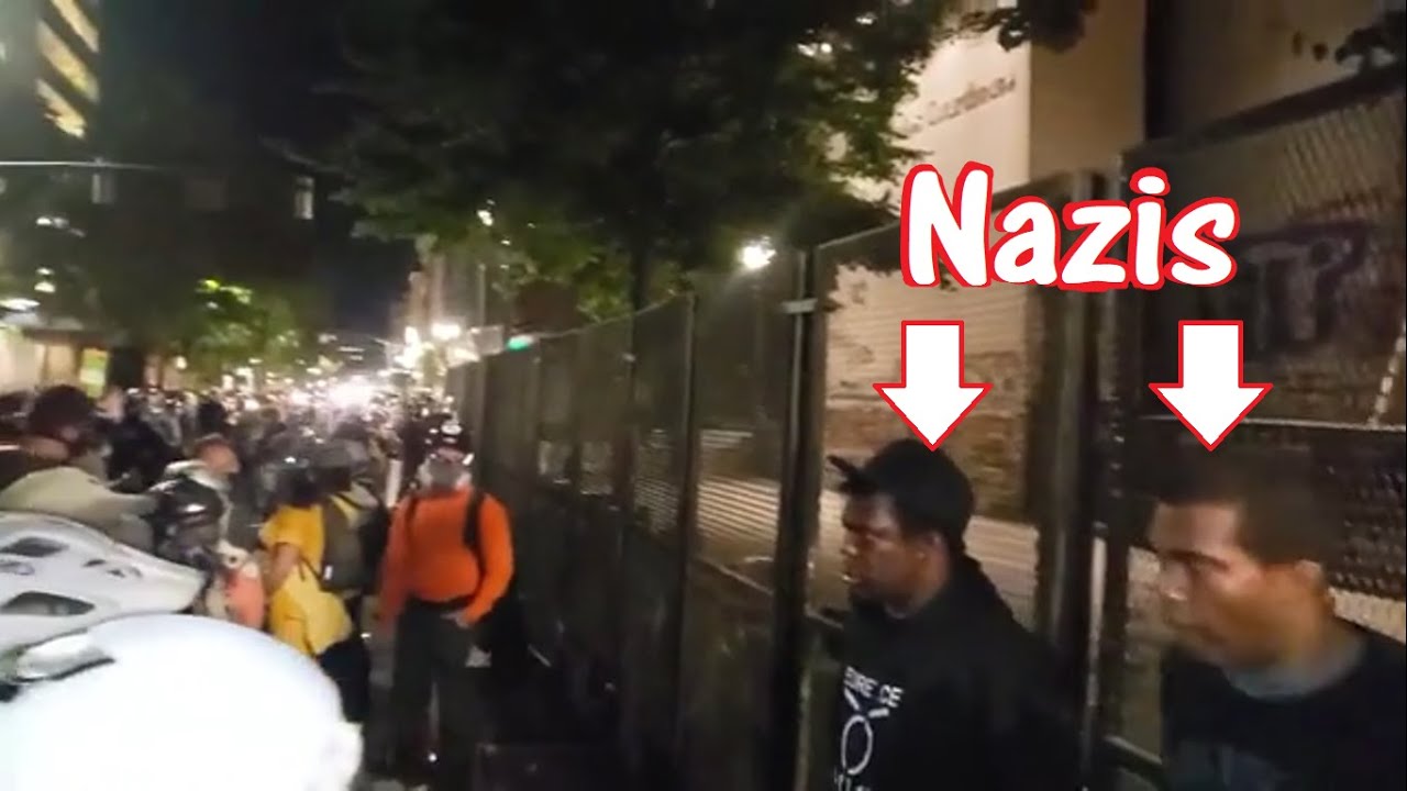 Two Black Men Are Defending the Fence of the Portland Federal ...