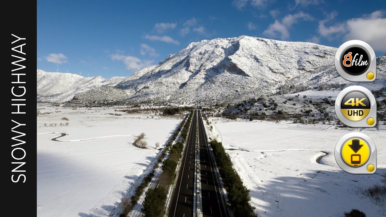 Snowy Highway. Αerial highway road stock Footage in snowy landscape ...