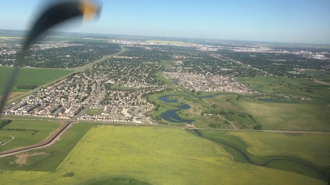 Landing at Regina International Airport (YYC to YQR) - YouTube