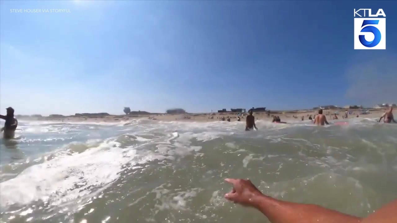 Video shows swimmer rescued from potentially deadly rip current - YouTube