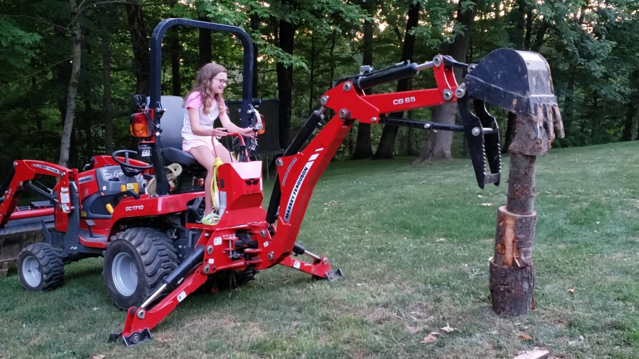 Crazy young backhoe skills.... my daughter - YouTube