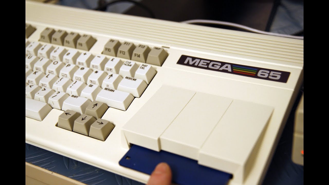MEGA65: Switching between 3.5" floppy drive and SD card disk images - YouTube