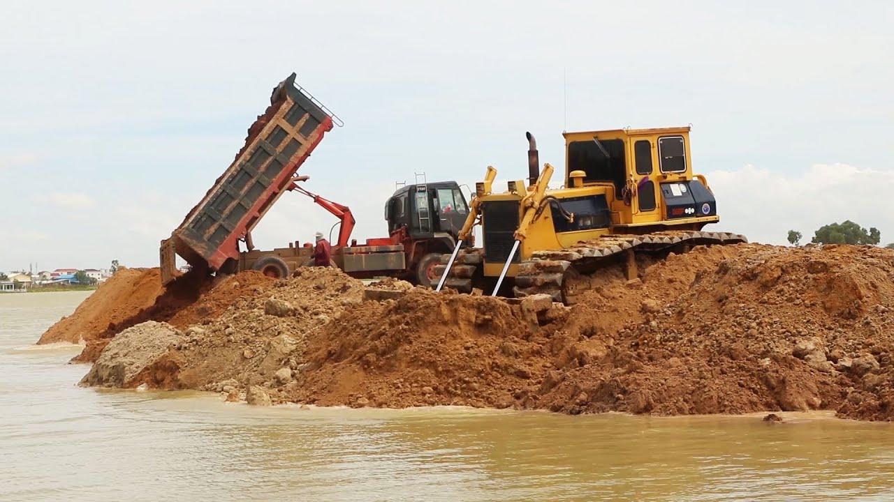 Wonderful Bulldozer Pushing Dirt into Water Filling Land & Awesome ...