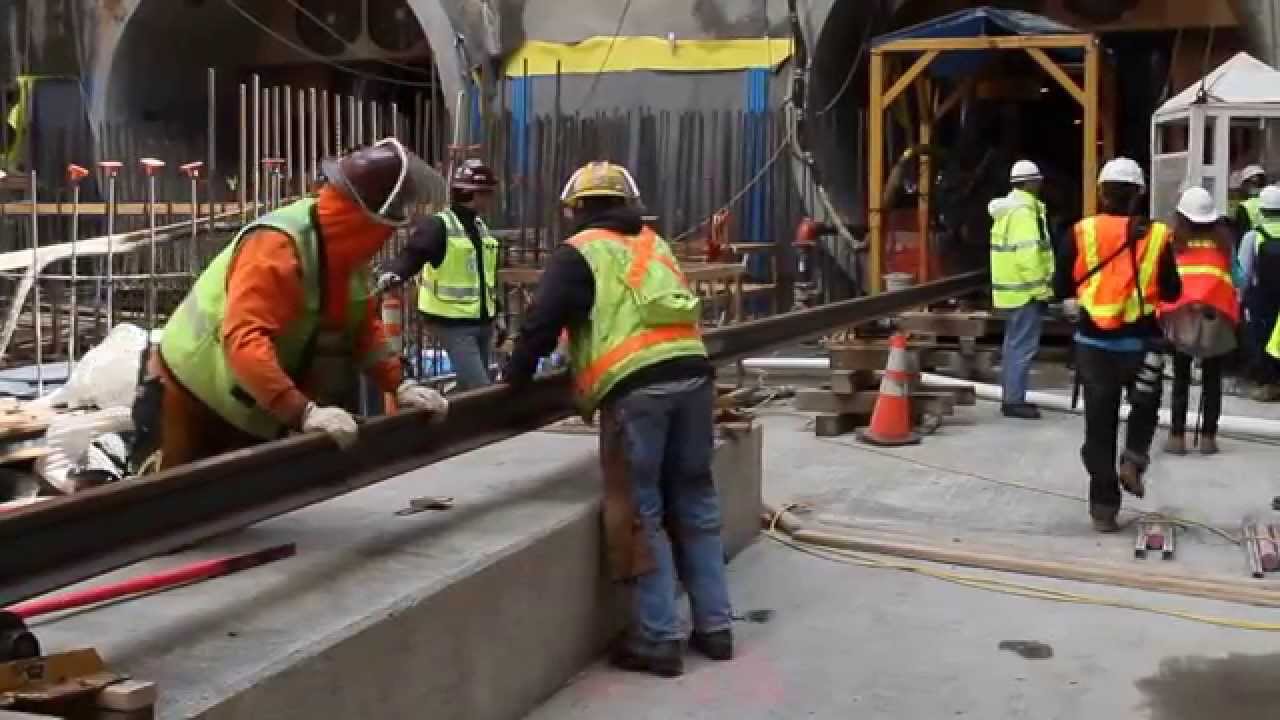 Rolling rail into place to be welded - YouTube