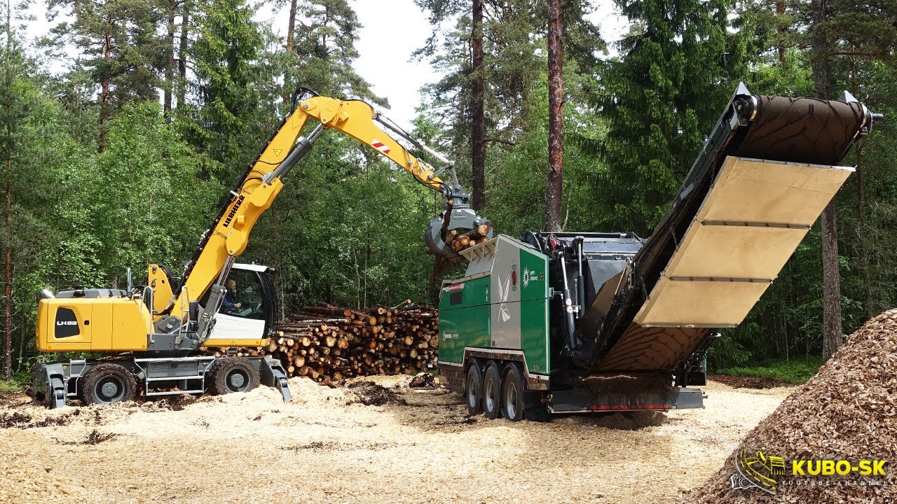 Liebherr LH22M excavator loading Komptech shredder with wood | ELMIA ...