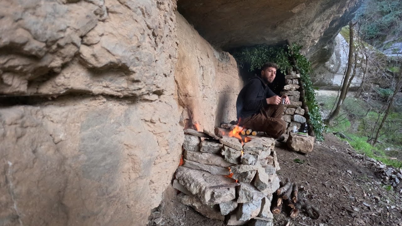Building of a ROCK shelter the side a LAKE & Solo survival camping ...