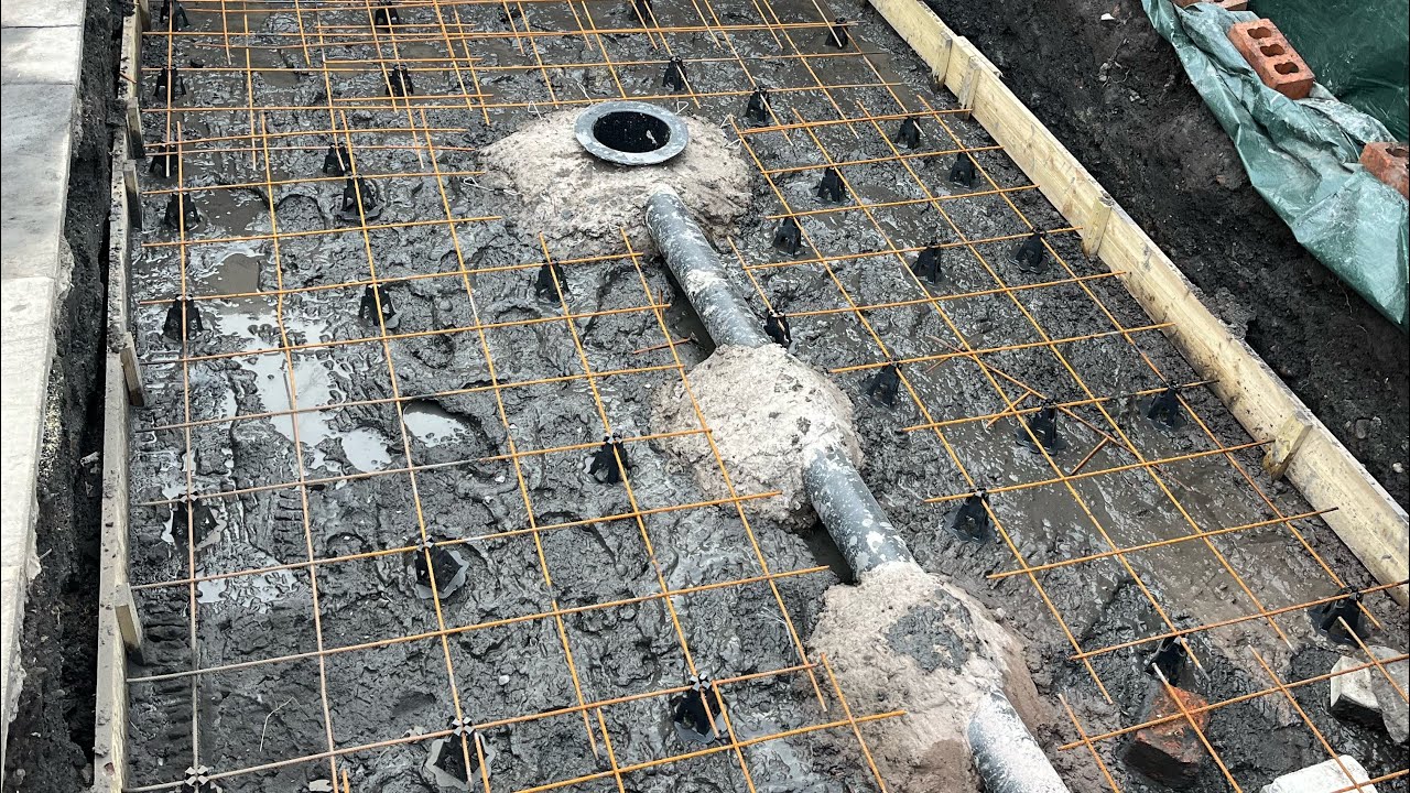 Slow progress, bottom drain installed and concrete prep on new pond ...