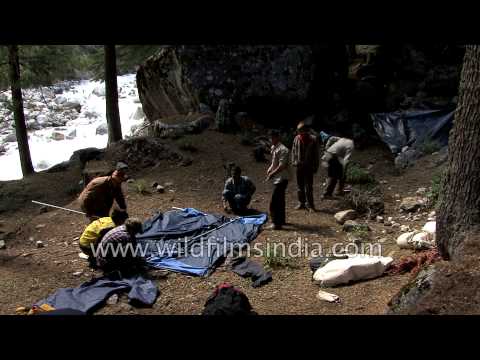 Porters setting up tents during the Lamkhaga Pass trek