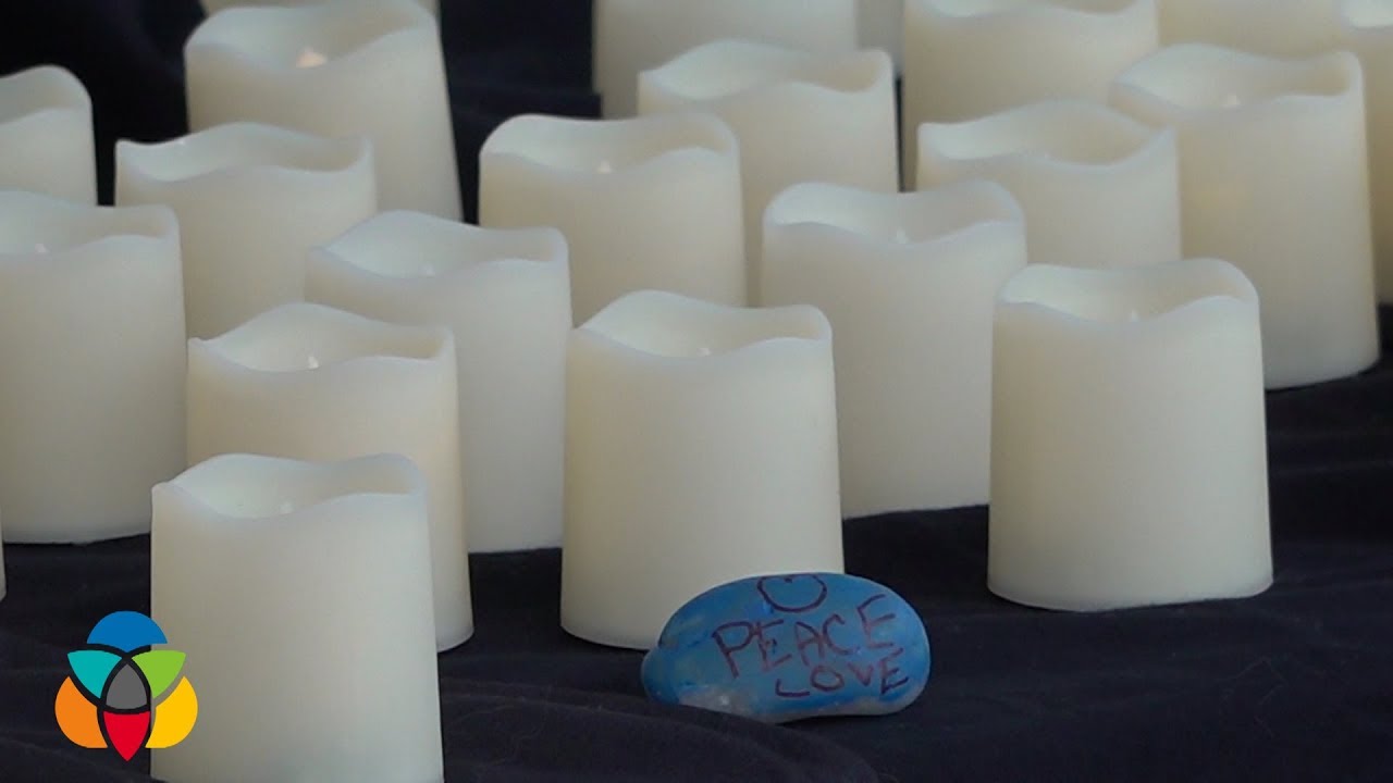 Candles burn bright for opioid victims - YouTube