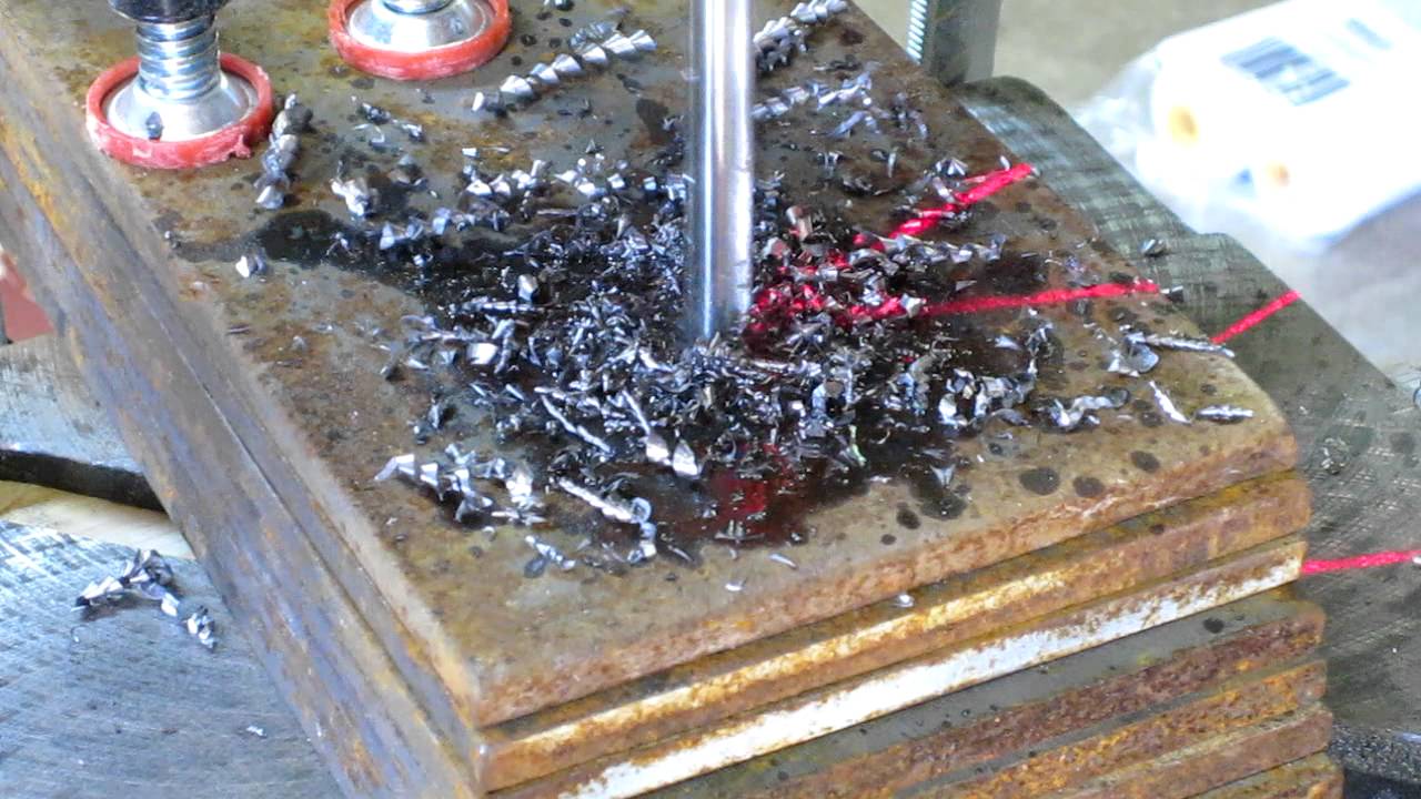 Drilling holes in the scrap metal - YouTube