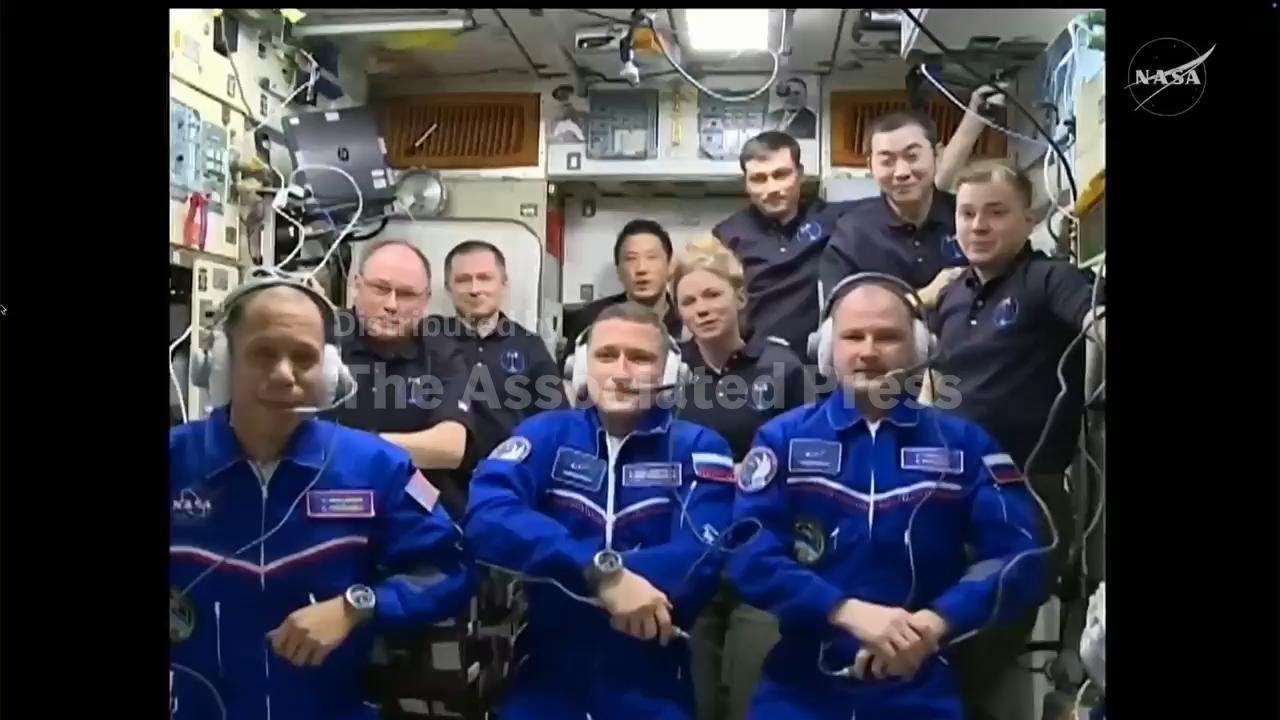 US-Russian crew aboard Soyuz spacecraft dock at International Space ...