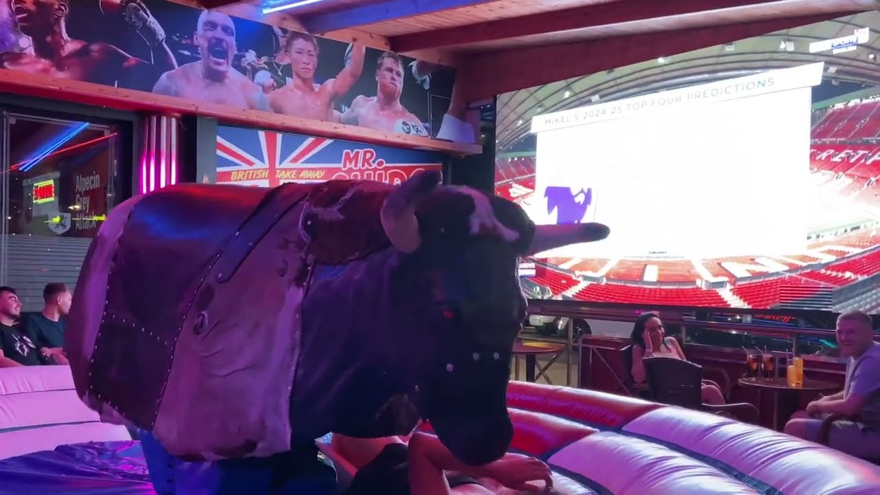 WOW😲BEAUTY TAKES ON Bull in Benidorm ! 😍Mechanical Bull Riding 4K Spain ...
