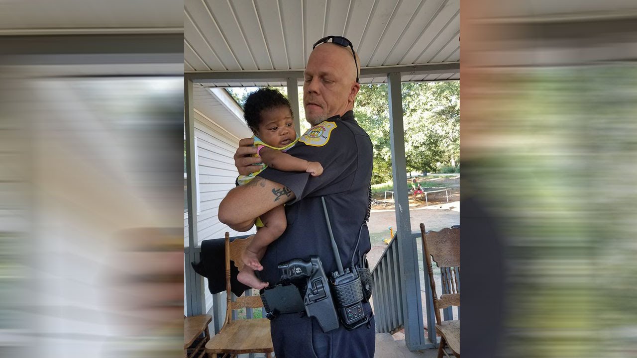 Officer saves baby's life, becomes her godfather - YouTube