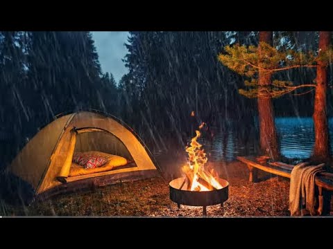 A calming stormy night camping in the tent next to the fire, to help ...