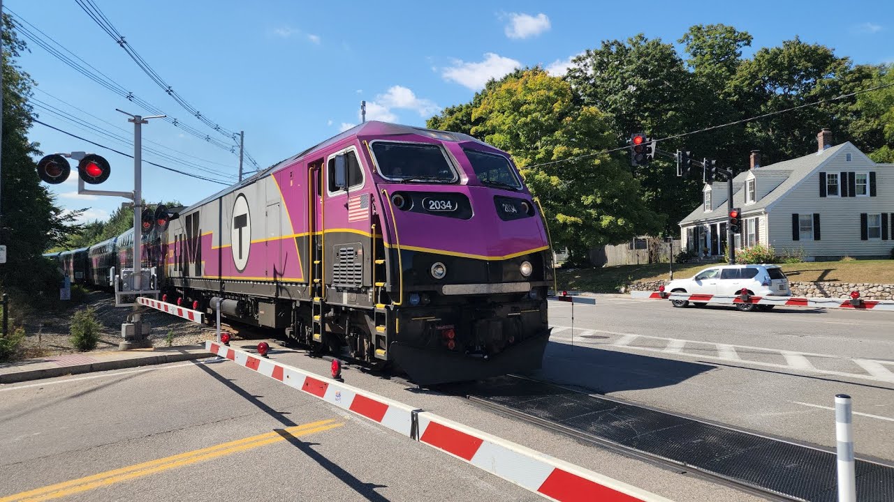 Greenbush Bound Commuter Rail train crossing South Street with a horn ...