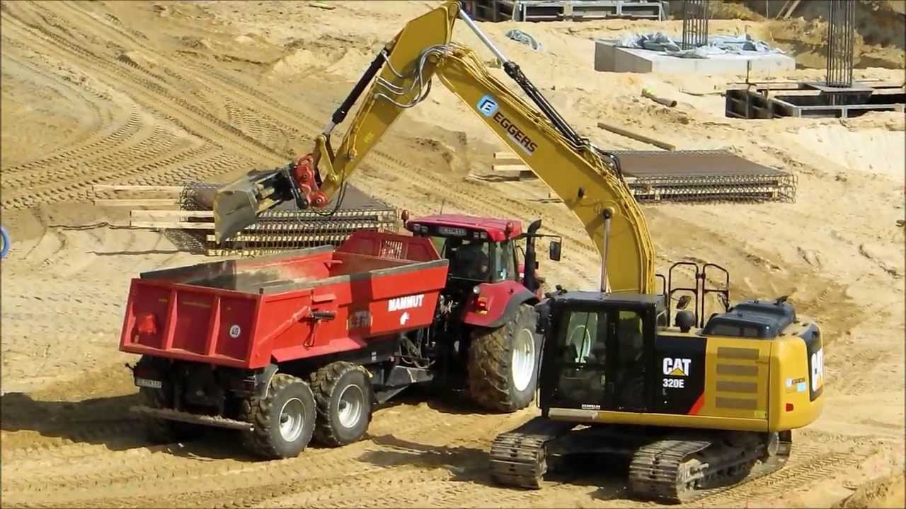 CATERPILLAR 320 E belädt Trecker STEYR 6195 CVT mit MAMMUT Muldenkipper ...