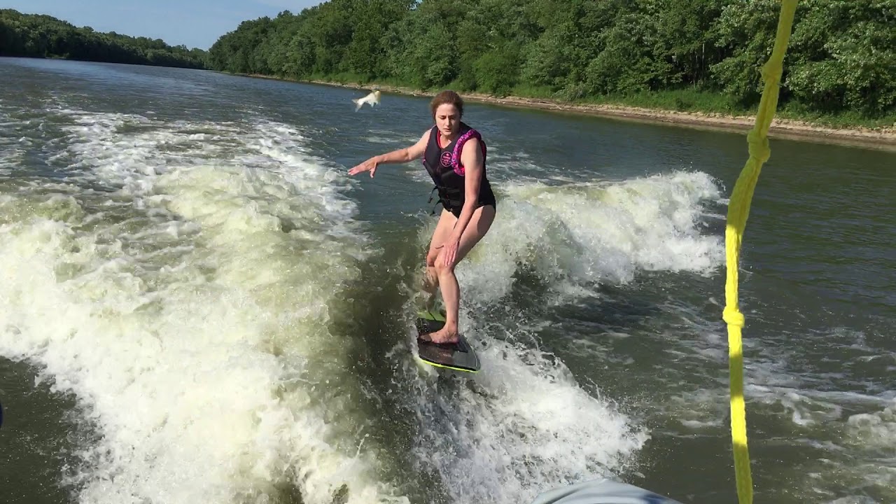 Kate surfing... with Asian carp - YouTube