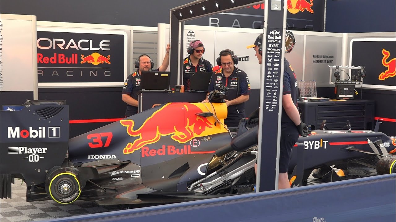 Redbull RB8 Formula 1 car engine start up and revving with backfires at ...