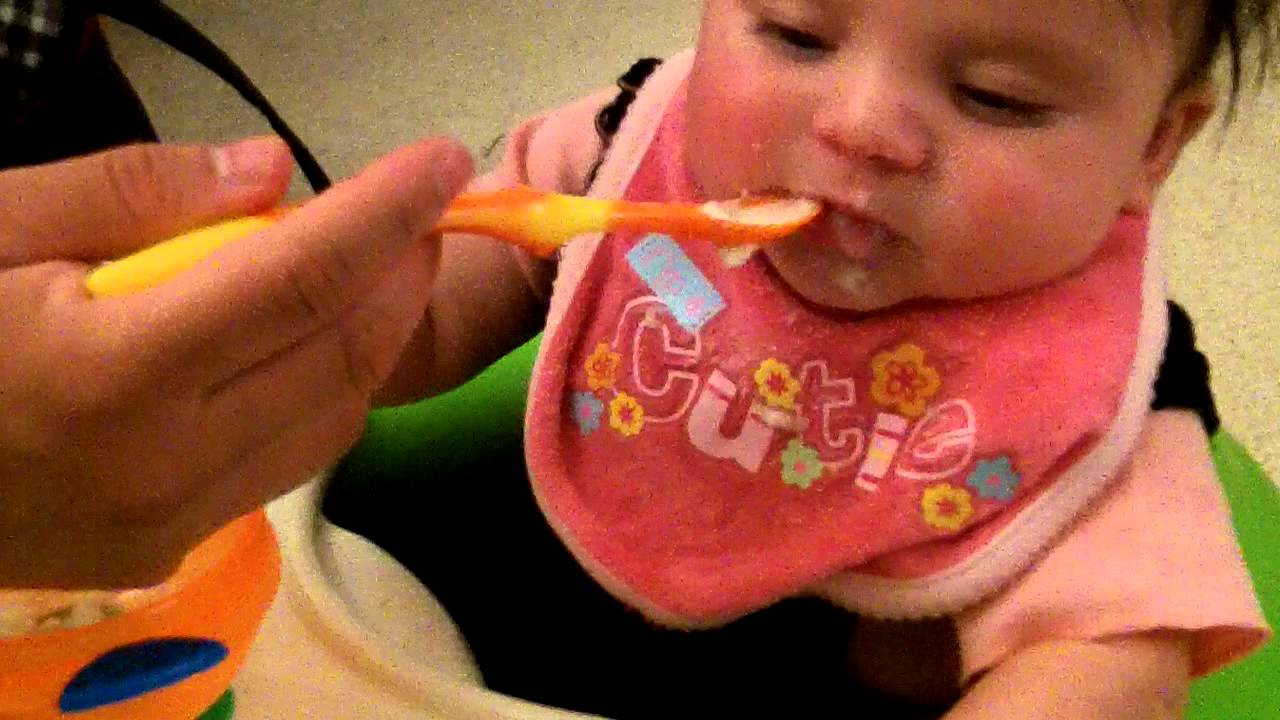 Maggie eats solid food - YouTube