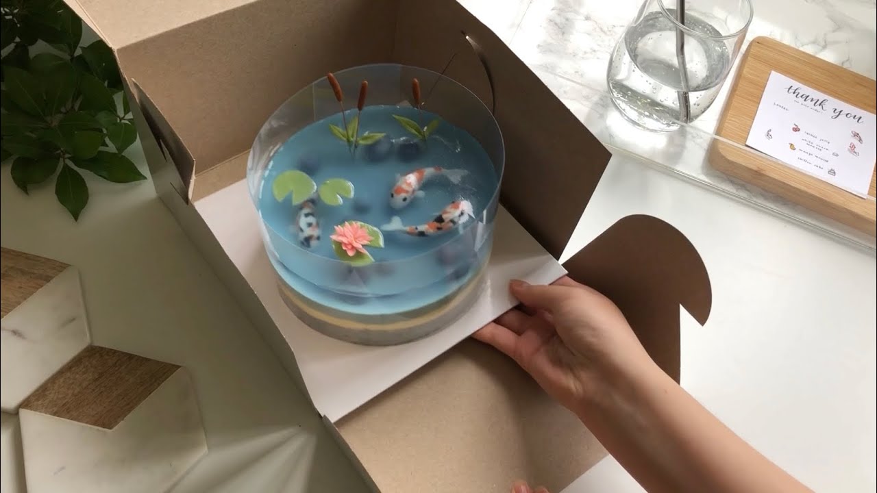 packaging a koi pond cake for order - YouTube