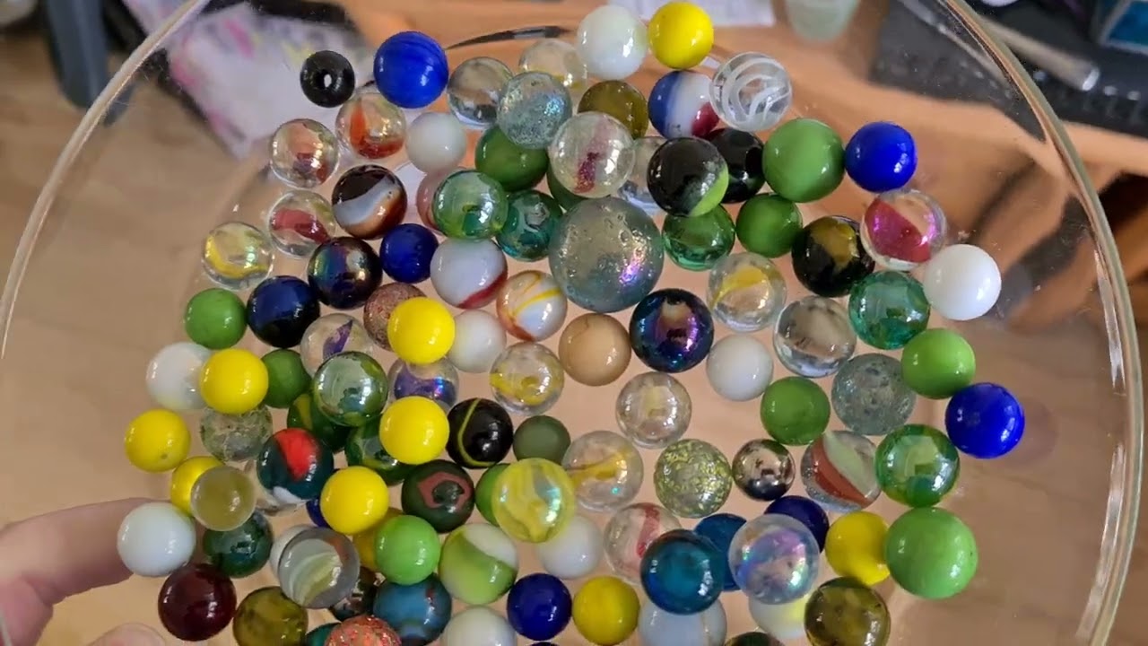 Marbles on glass plate - YouTube
