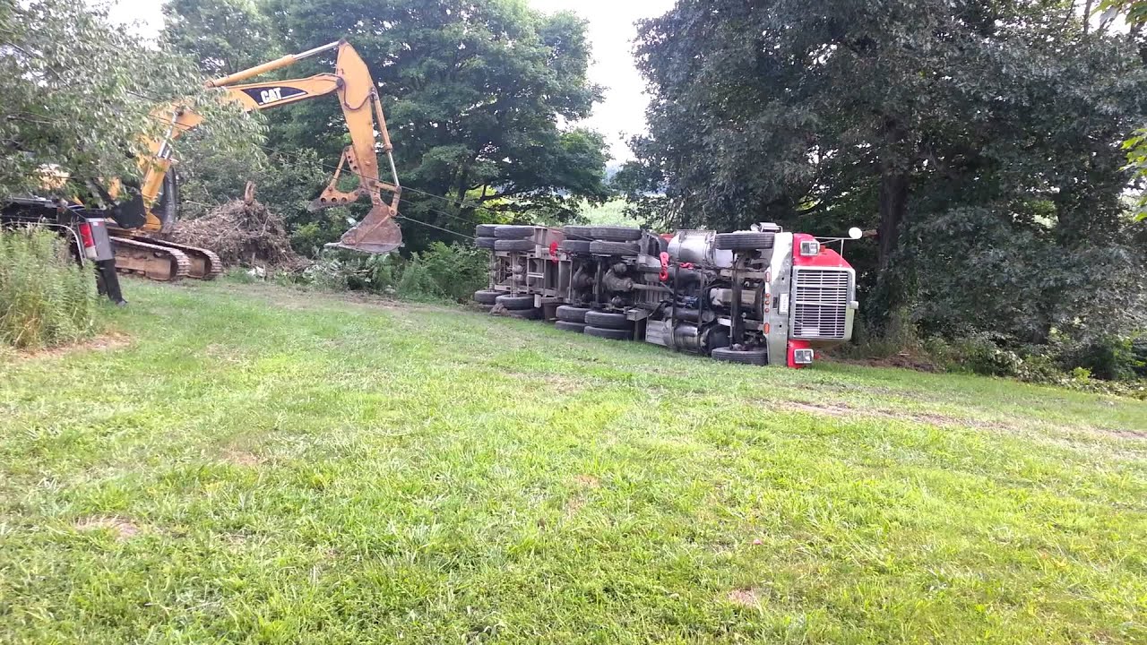 Semi and dump trailer turned over - YouTube