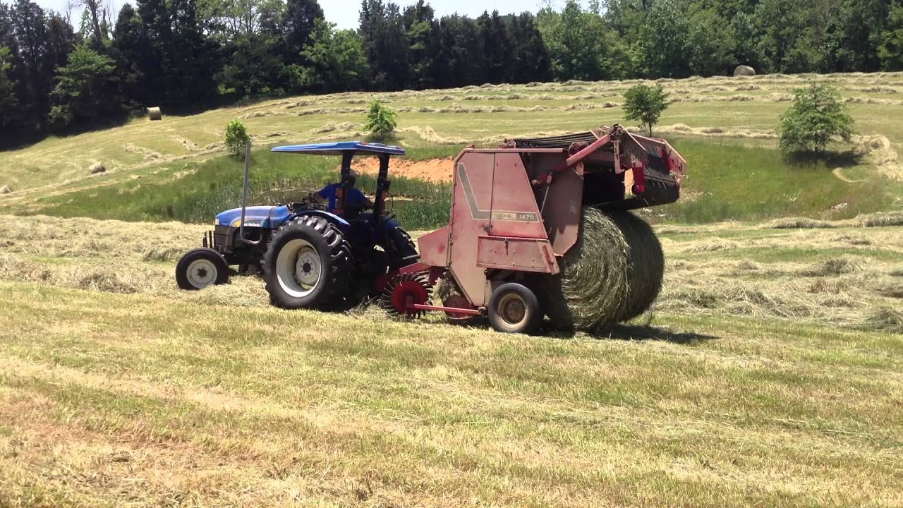 Ford New Holland and Hay Roller - YouTube