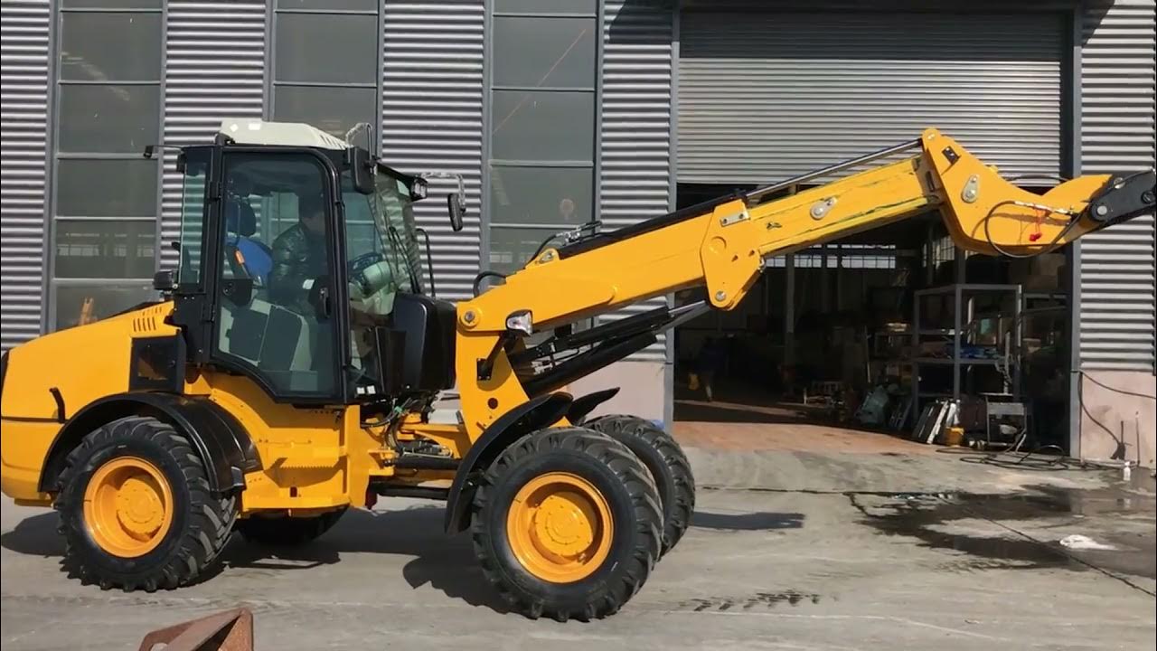 Телескопический погрузчик QUADTRAC WL100T - YouTube