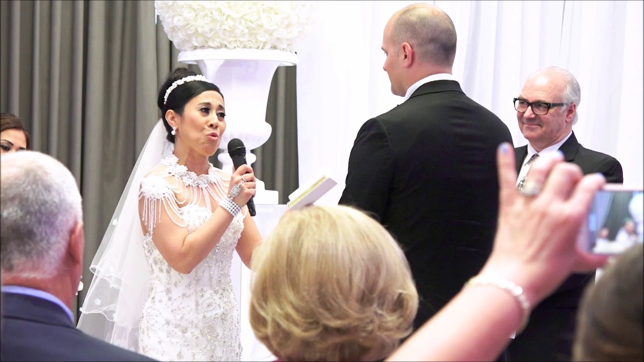 Bride surprises Groom with singing vows - YouTube
