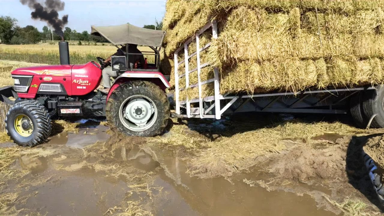 Fully Loaded Trolley of Straw Stuck in Water Pushing By Mahindra Arjun ...