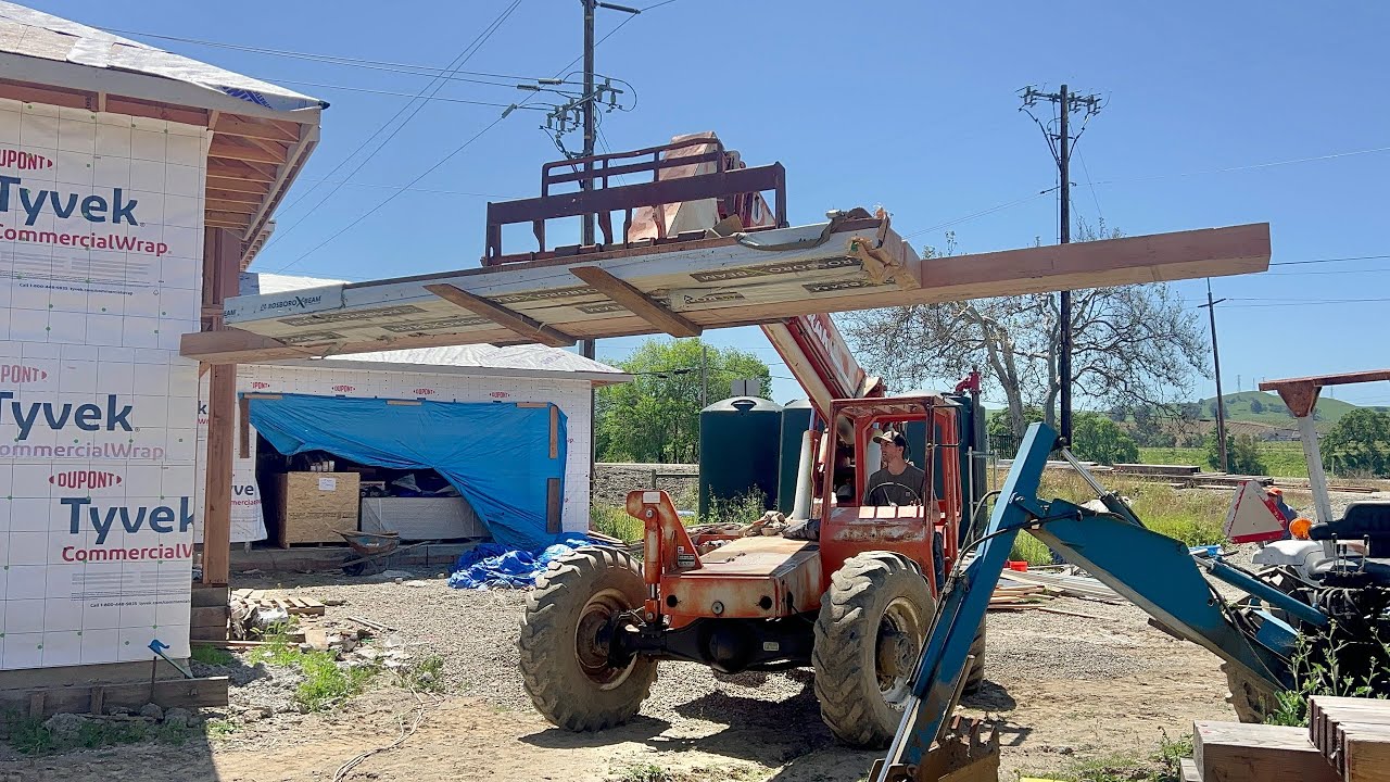 Installing our 20’ Tall Patio Roof with a Skytrak 8042 Telehandler ...