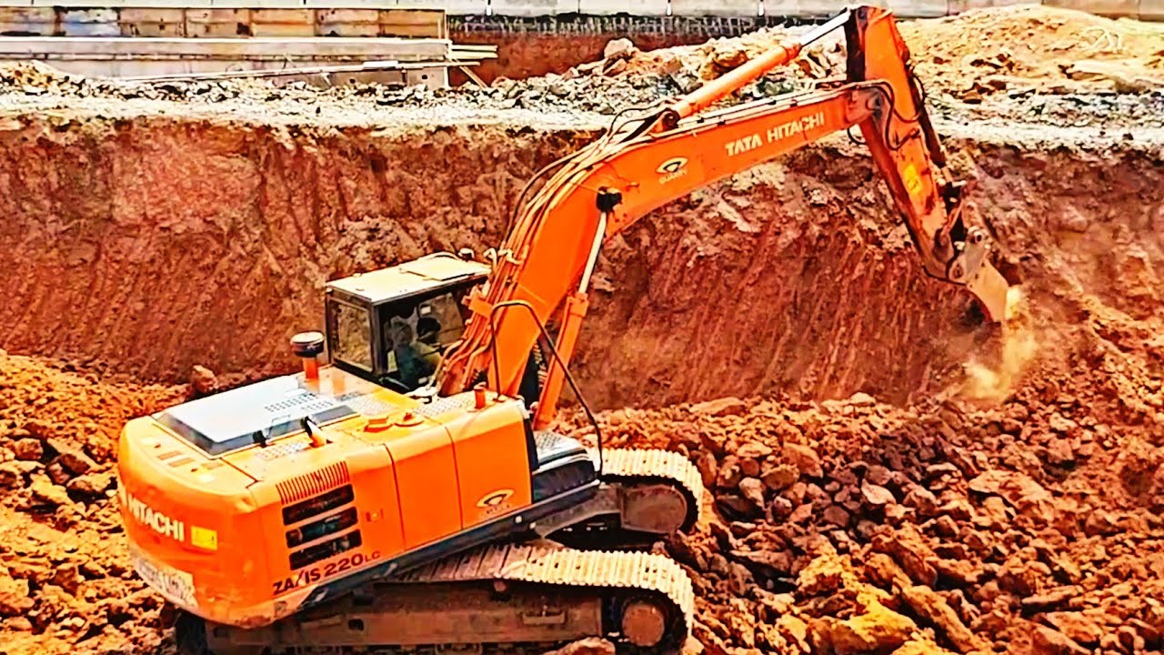 A machine that is scraping and breaking red rocks #stonecuttingmachine ...